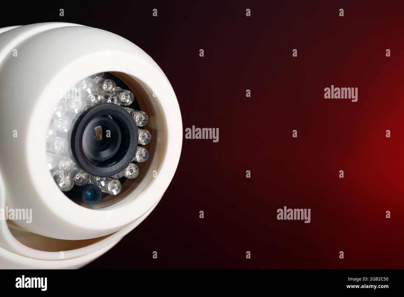 Security CCTV camera on red background, closeup Stock Photo - Alamy