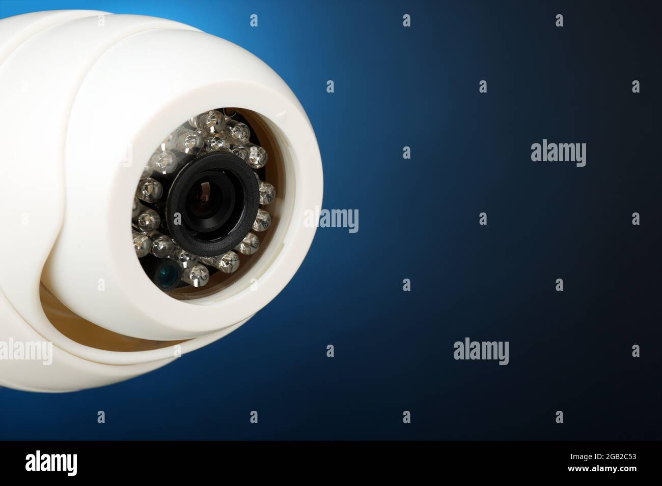 Security CCTV camera on blue background, closeup Stock Photo - Alamy