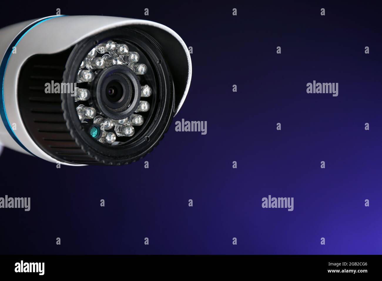 Security CCTV camera on blue background, closeup Stock Photo - Alamy