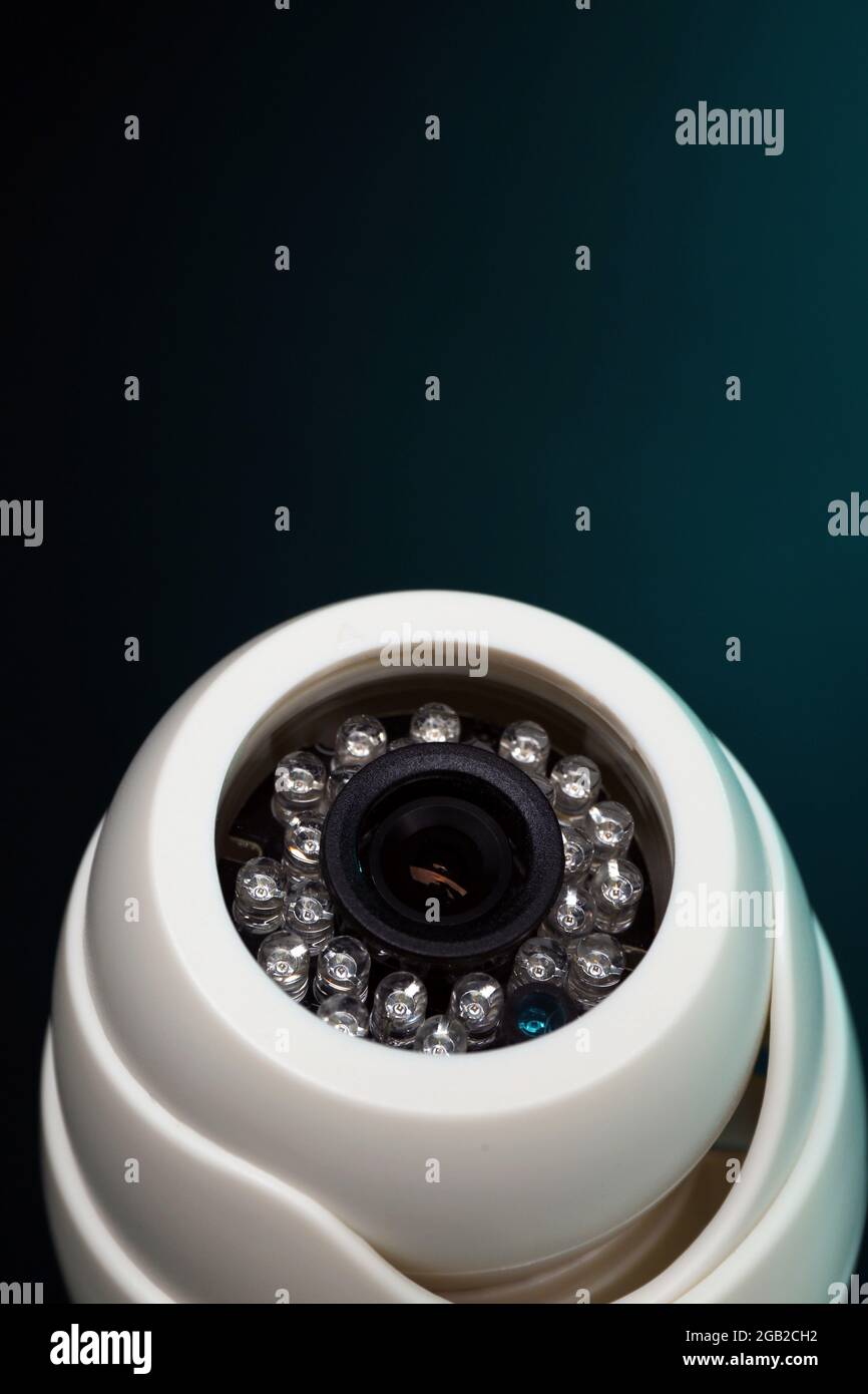 Security CCTV camera on blue background, closeup Stock Photo - Alamy