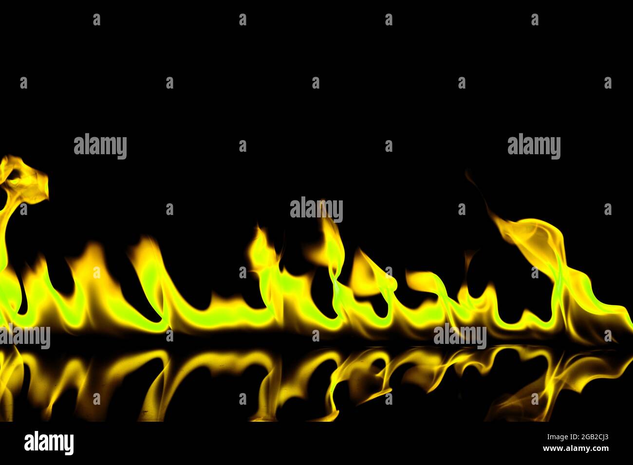 Yellow fire flames on black background Stock Photo - Alamy