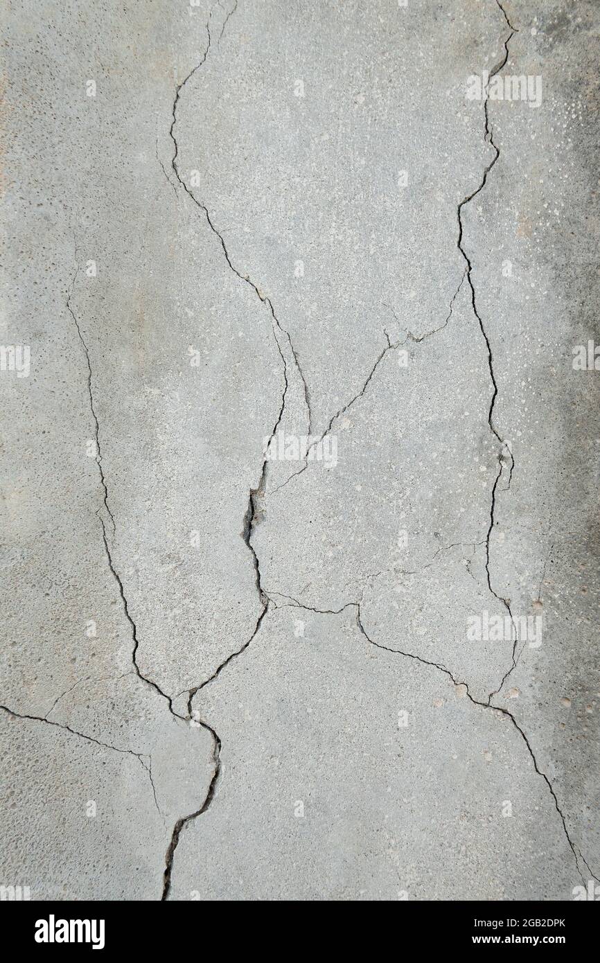 Cement wall cracks broken texture background Stock Photo - Alamy