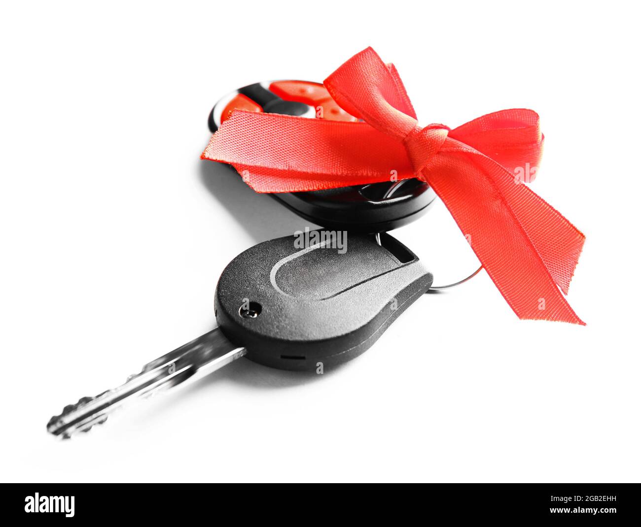 Gift car keys with red bow, isolated on white Stock Photo - Alamy