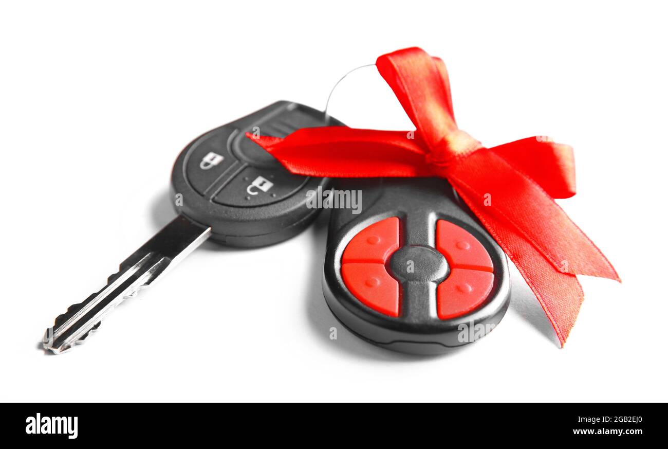 Gift car keys with red bow, isolated on white Stock Photo - Alamy
