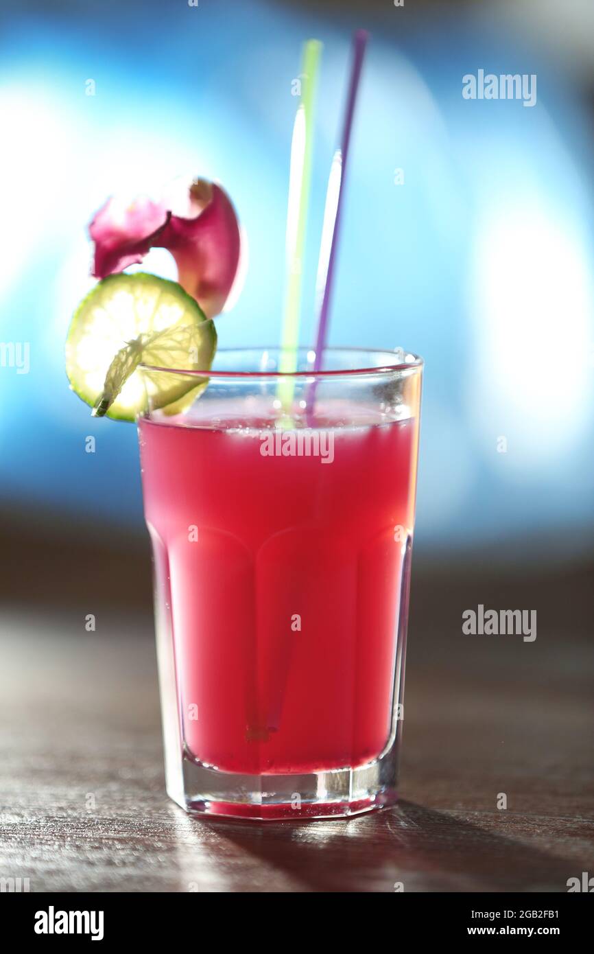 Glass of cocktail on bar background Stock Photo - Alamy