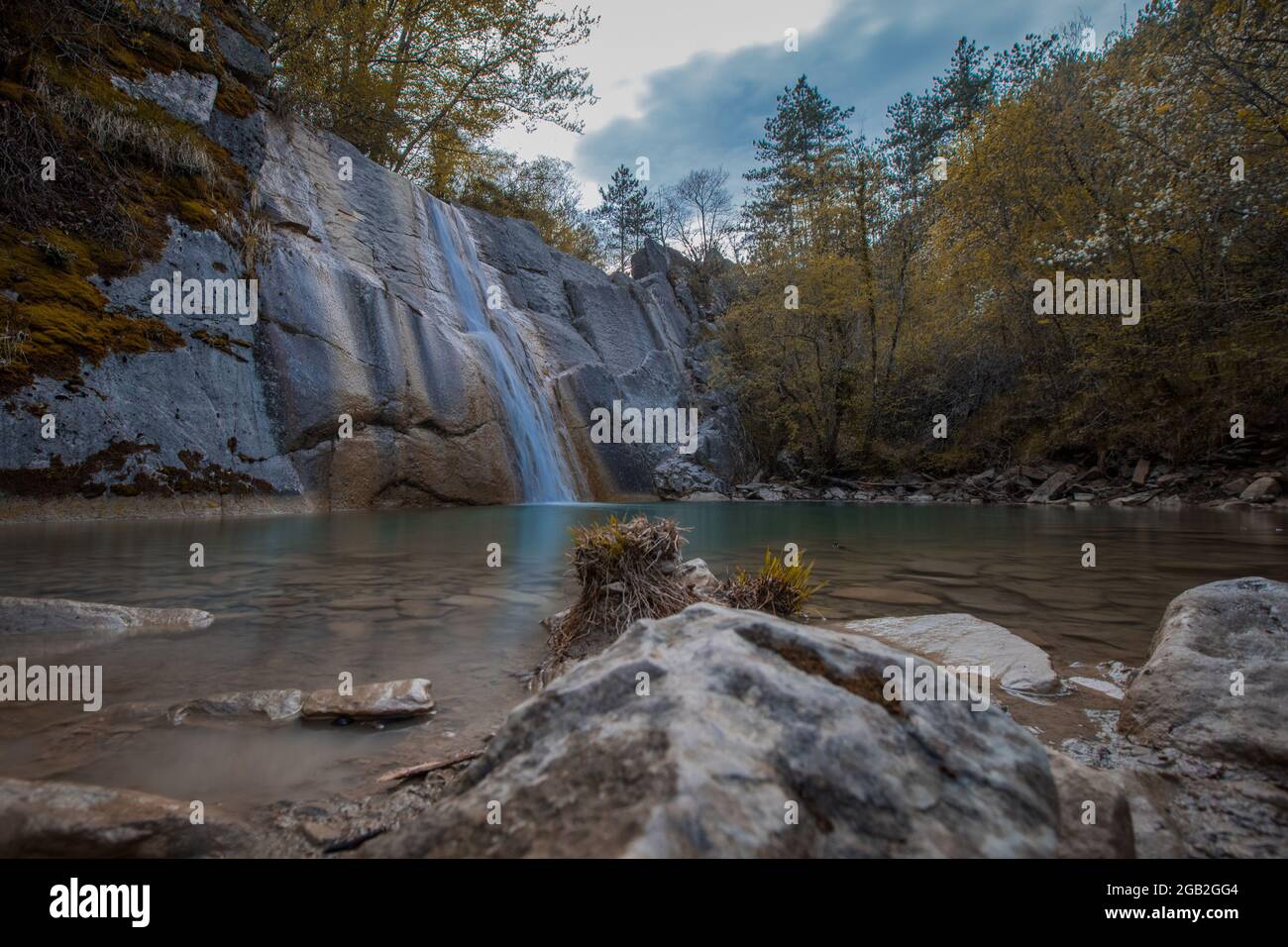 Beautiful waterfall on a sandstone rock formation in spring time, with ...