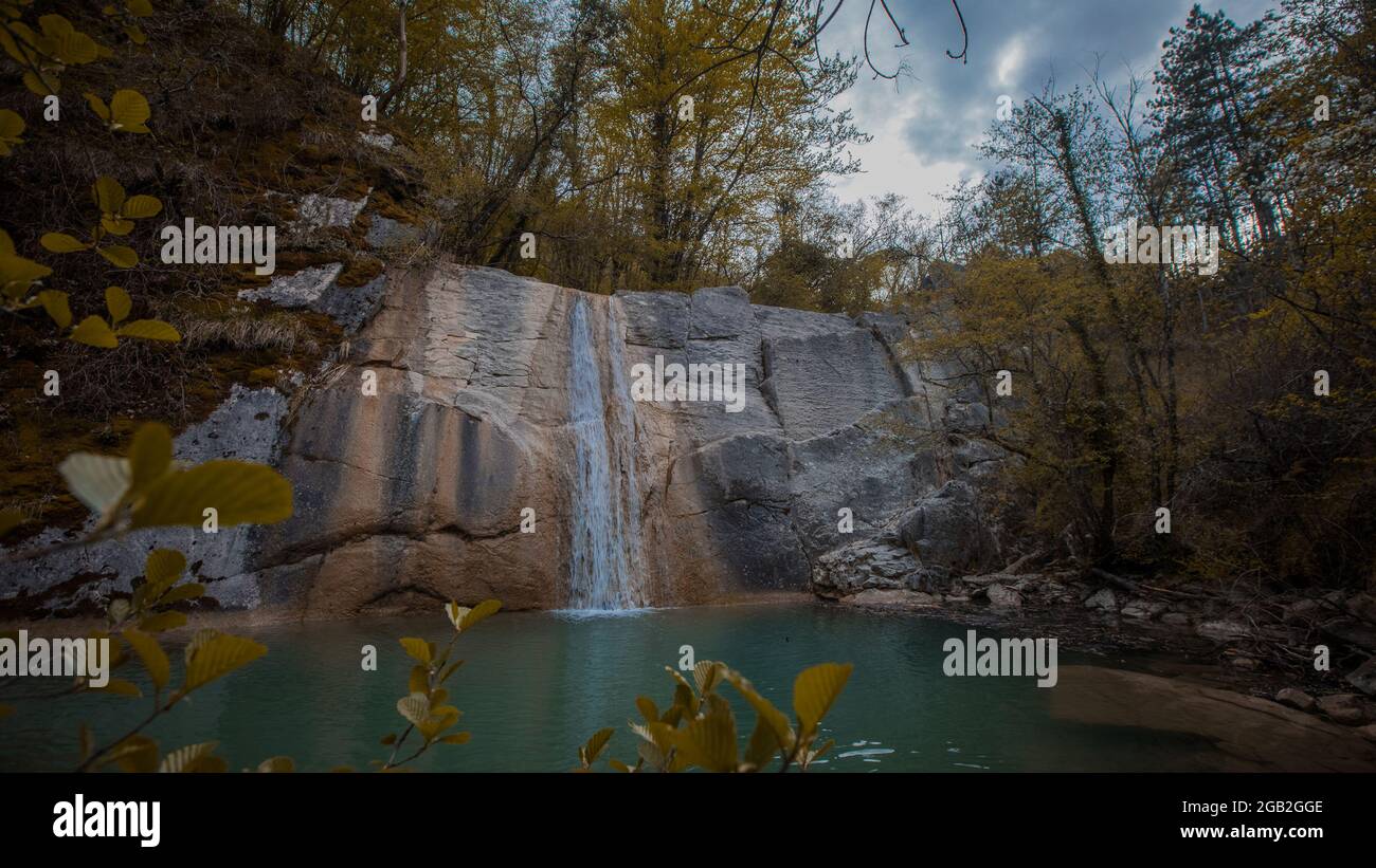 Beautiful waterfall on a sandstone rock formation in spring time, with ...