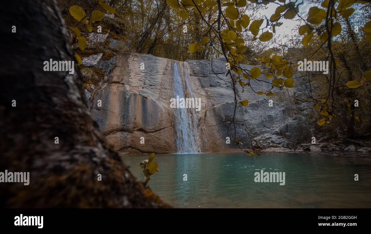 Beautiful waterfall on a sandstone rock formation in spring time, with ...