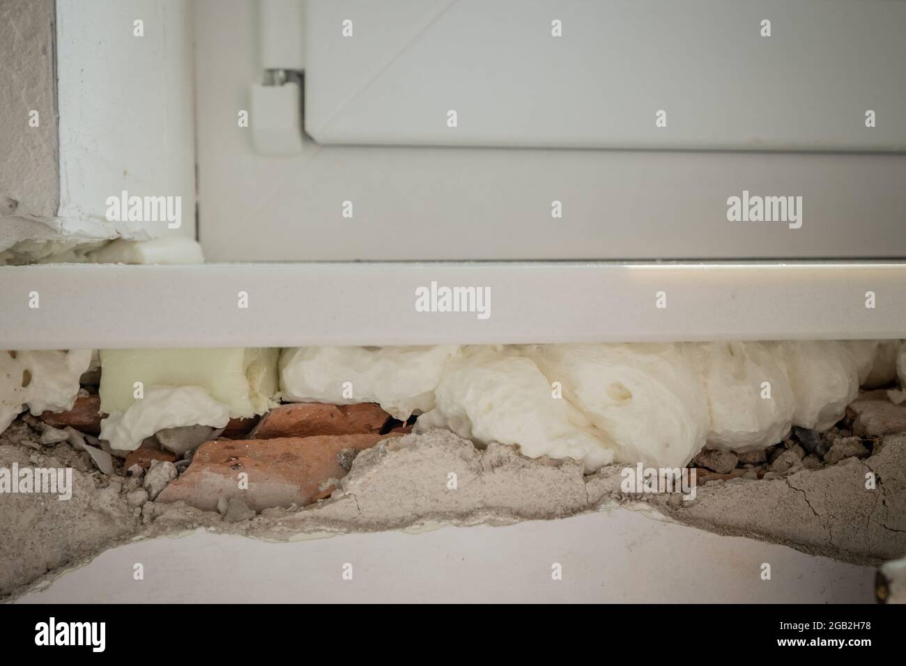 Detail of PU poliurethane expanding foam used for fixing window ledges ...