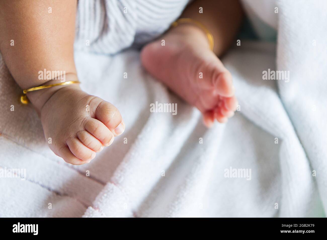 Two babys feet hi-res stock photography and images - Alamy