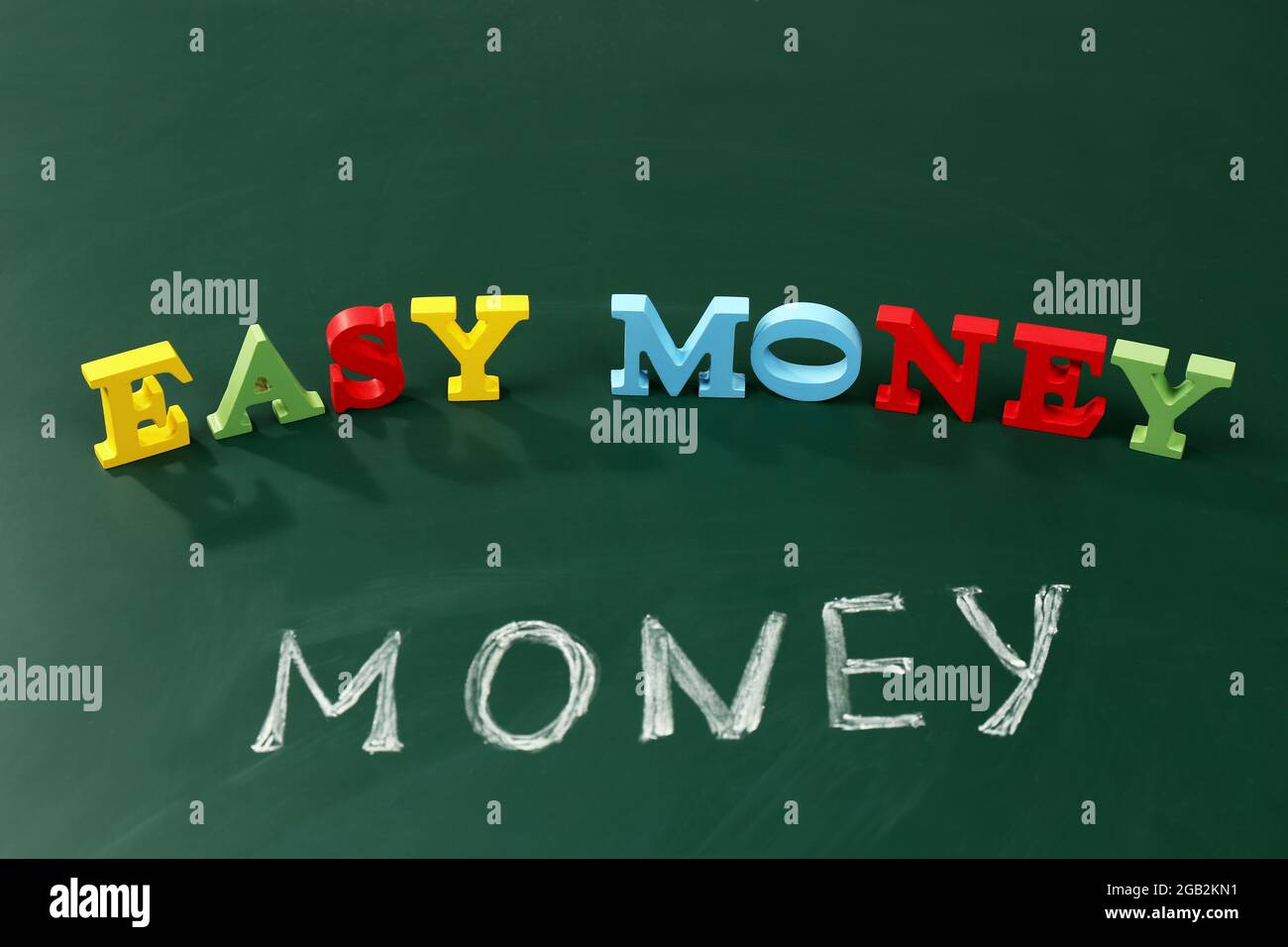 Easy money concept on a blackboard background Stock Photo - Alamy