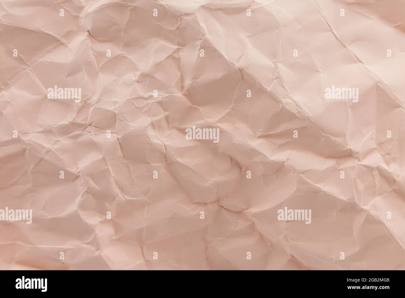 Pink crumpled paper surface background Stock Photo - Alamy