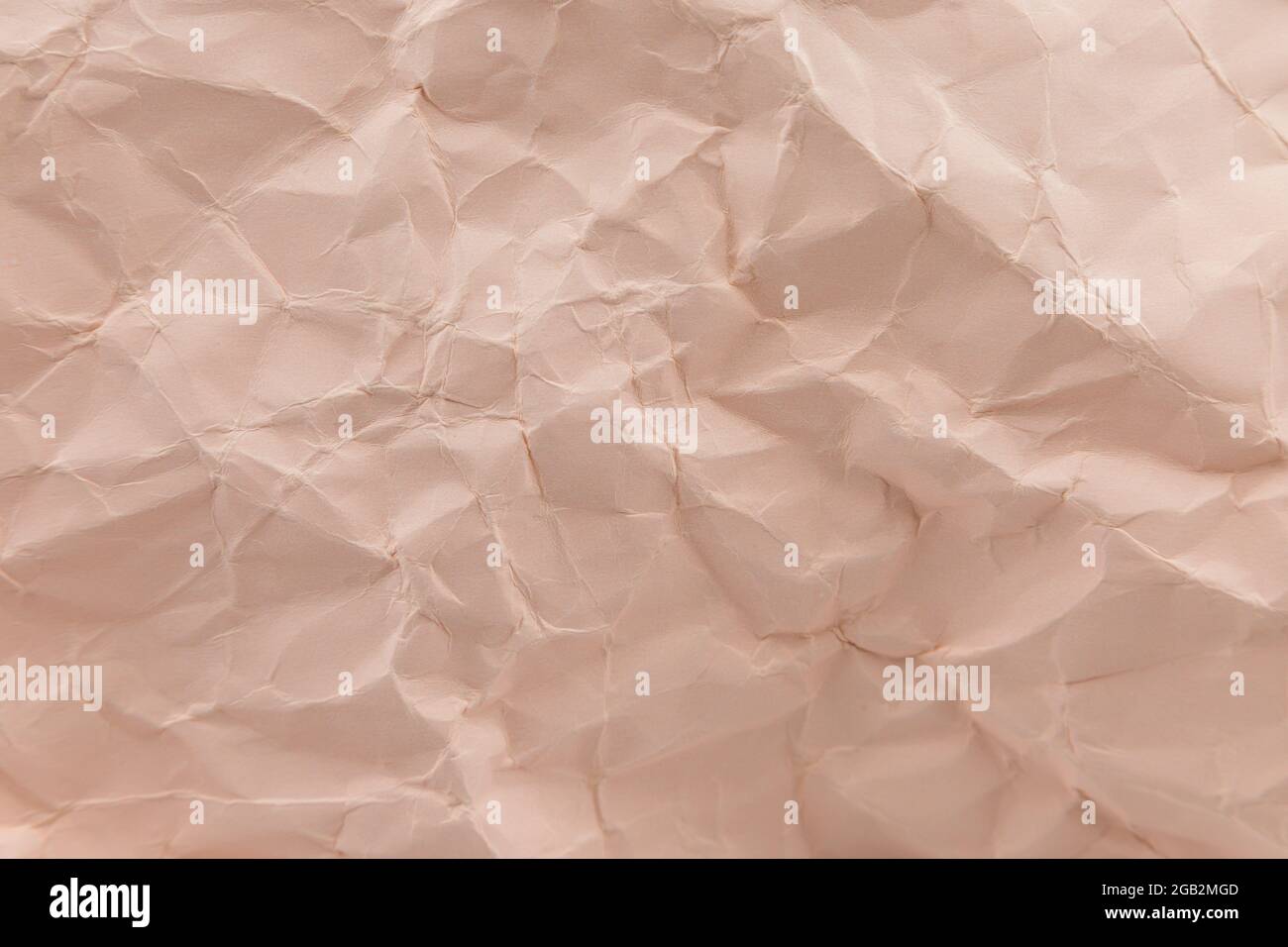 Pink crumpled paper surface background Stock Photo - Alamy