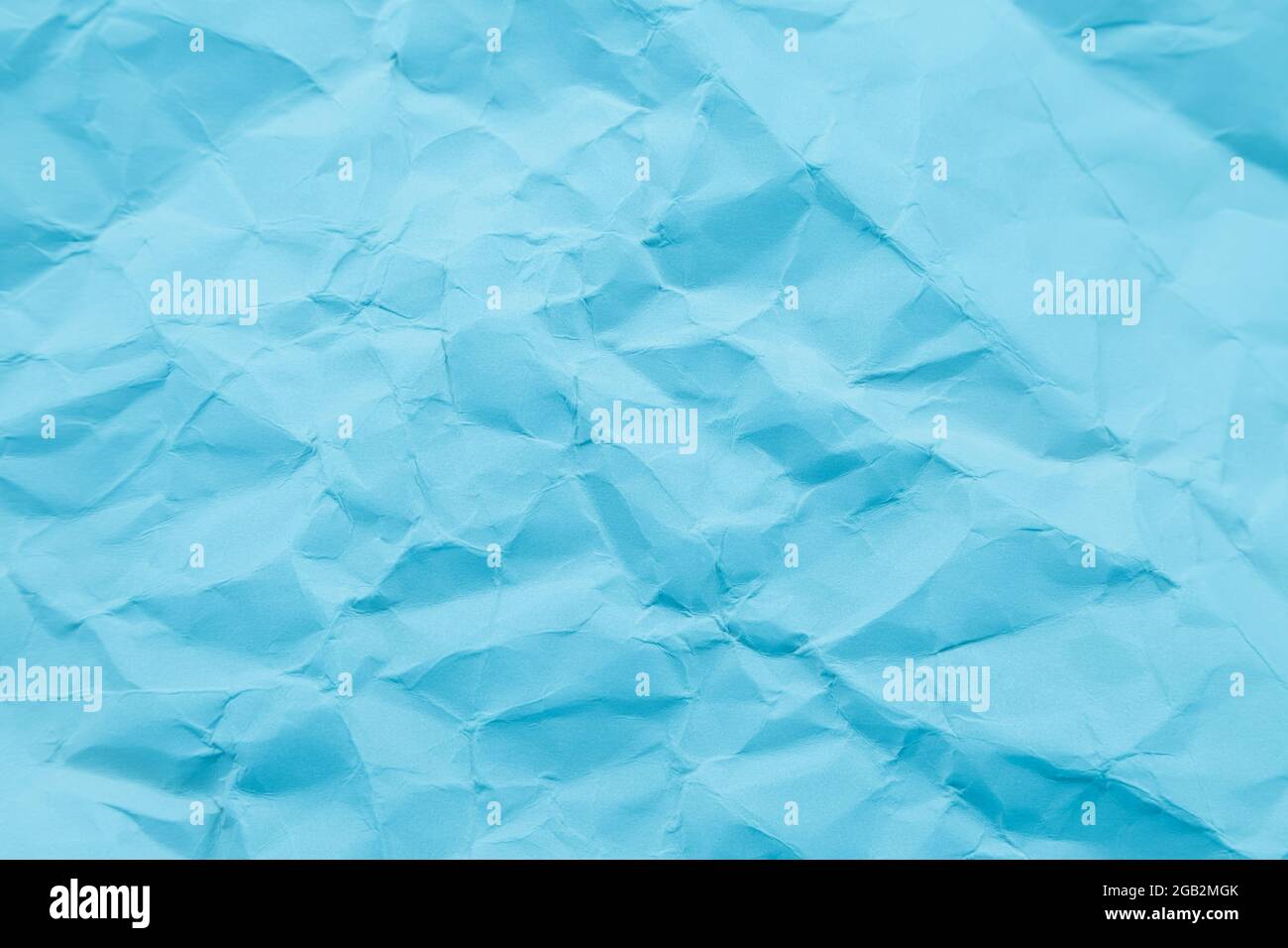 Blue crumpled paper surface background Stock Photo - Alamy