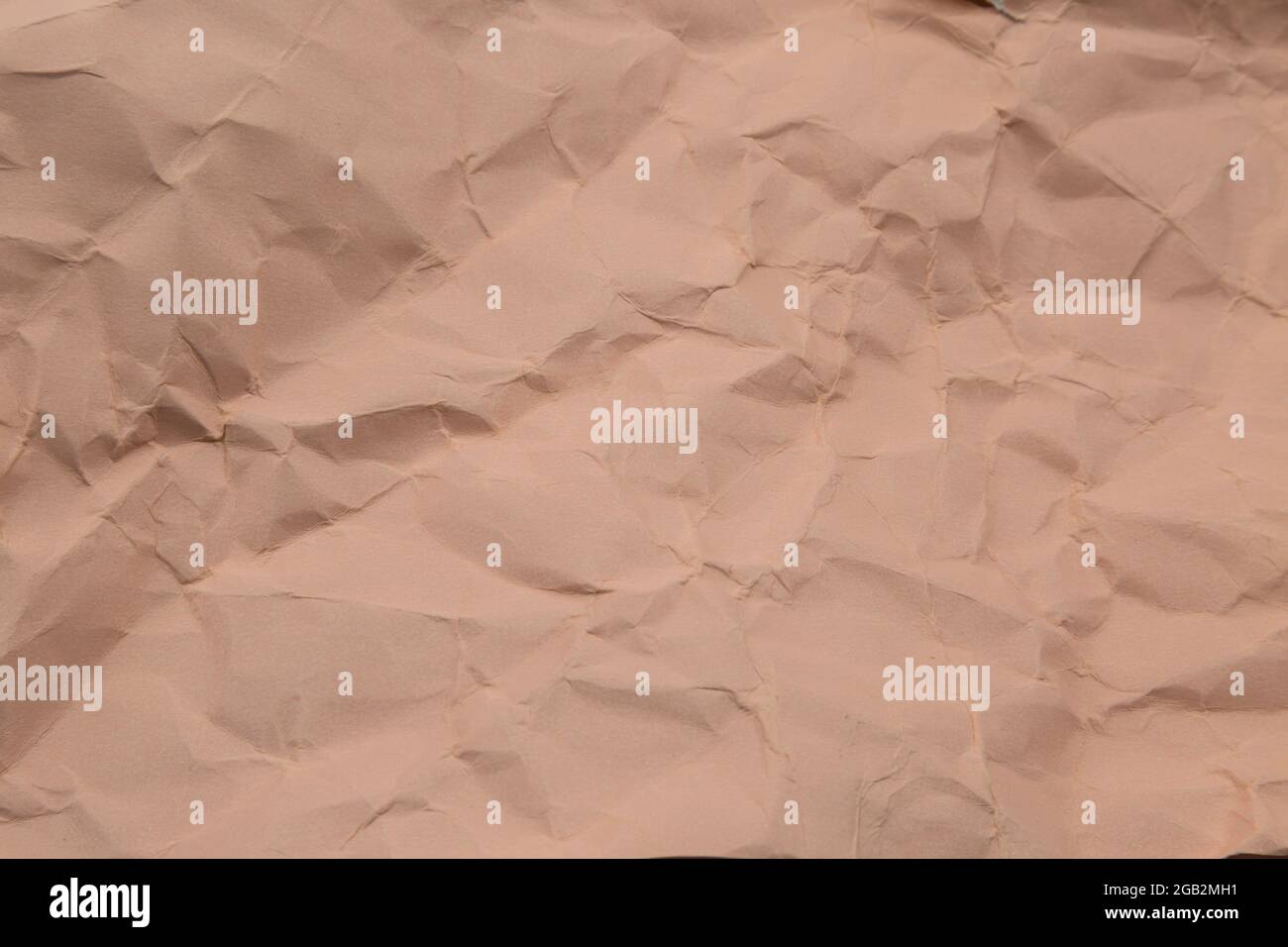 Pink crumpled paper surface background Stock Photo - Alamy