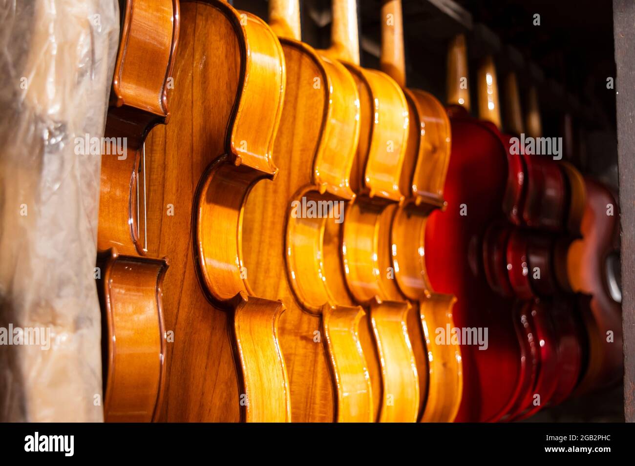 Many violins are hanging in a musical shop for ready to sell Stock ...