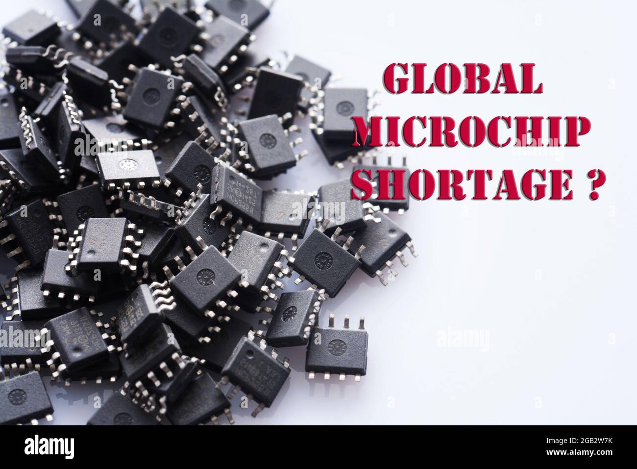 Pile of Integrated circuit chip on white background. Global microchip shortage. Concept for ...