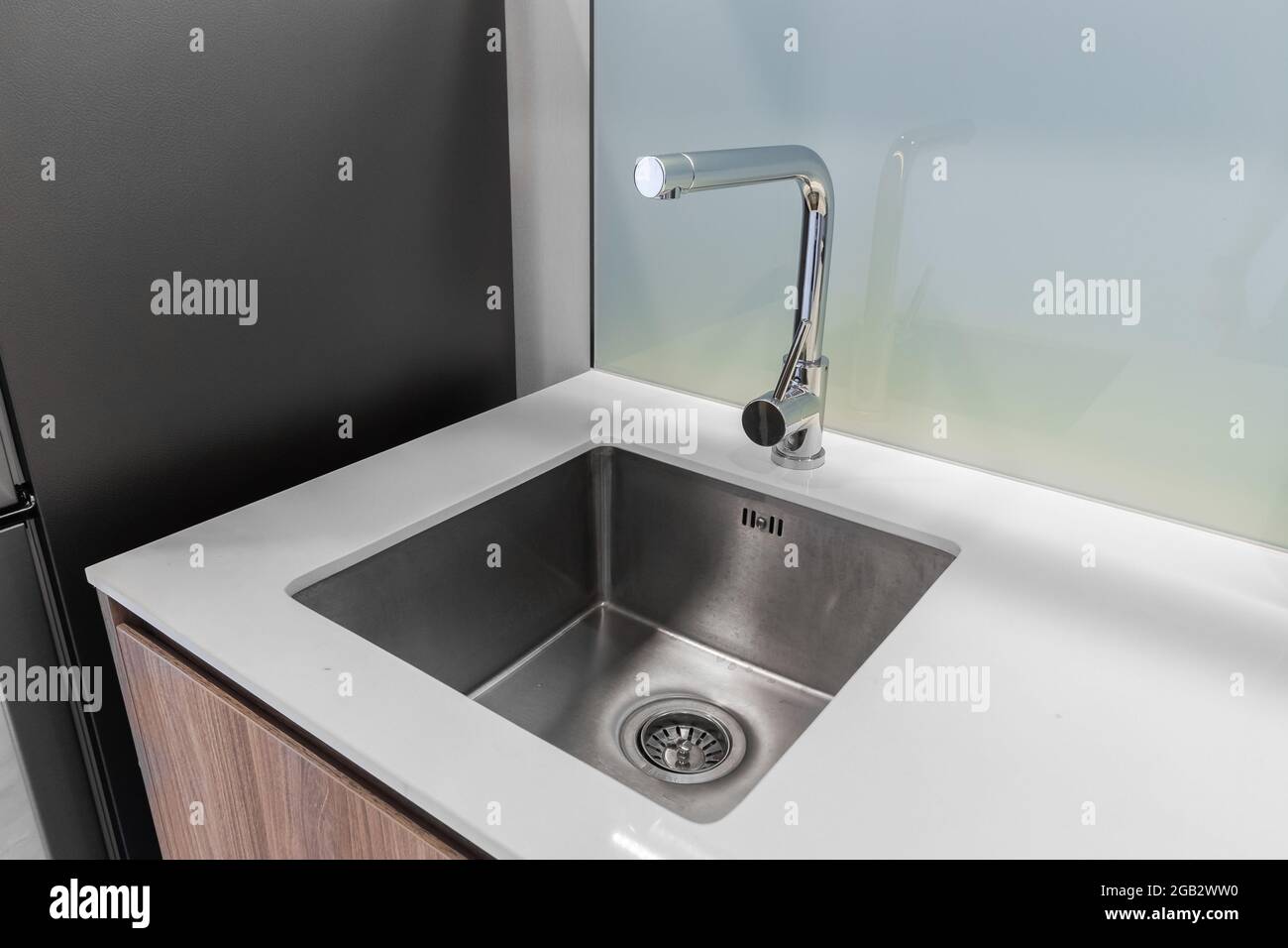 Clean stainless steel sink in with counter tops Stock Photo - Alamy