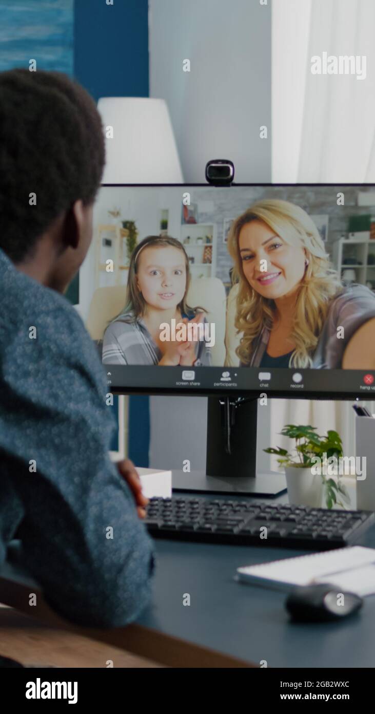 African american man talking with friends and family using online video ...