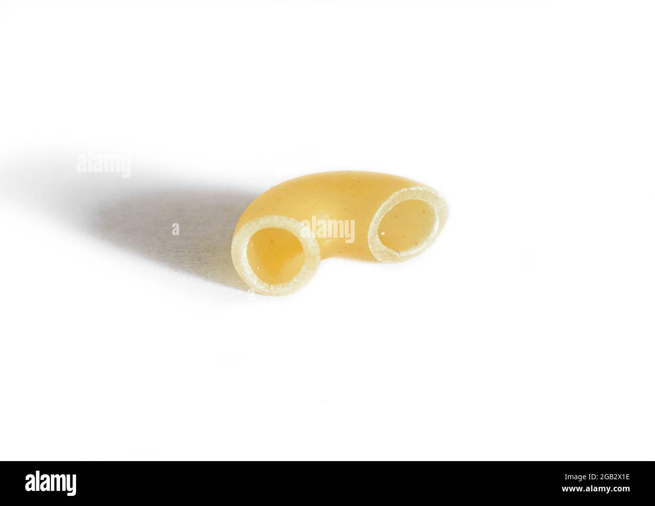One macaroni isolated on a white background. Macro Stock Photo - Alamy