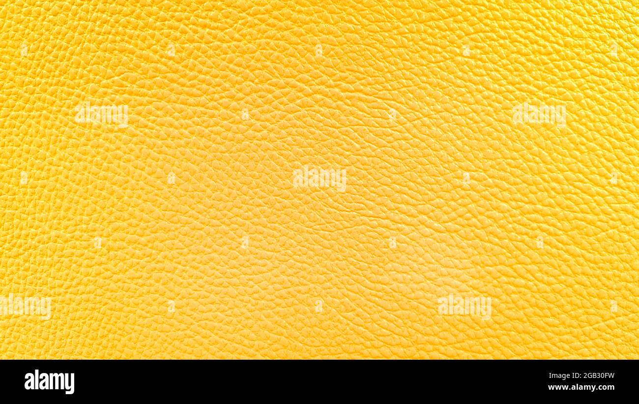 Yellow leather closeup texture background Stock Photo - Alamy