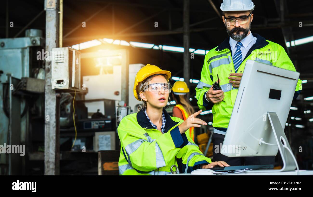 Industrial engineer wearing white helmet check, inspect and talk with ...