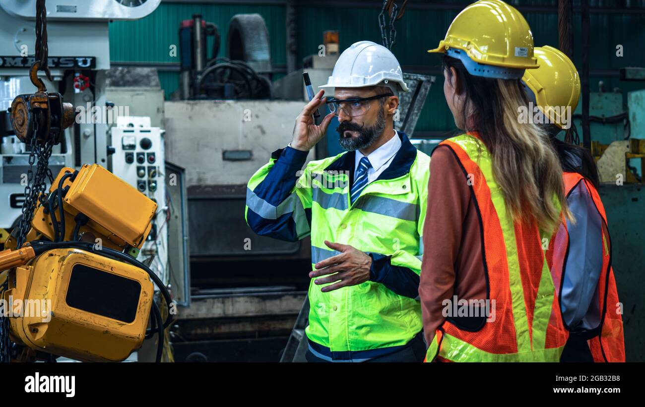 Mechanical engineer manager working in industry and factory control ...