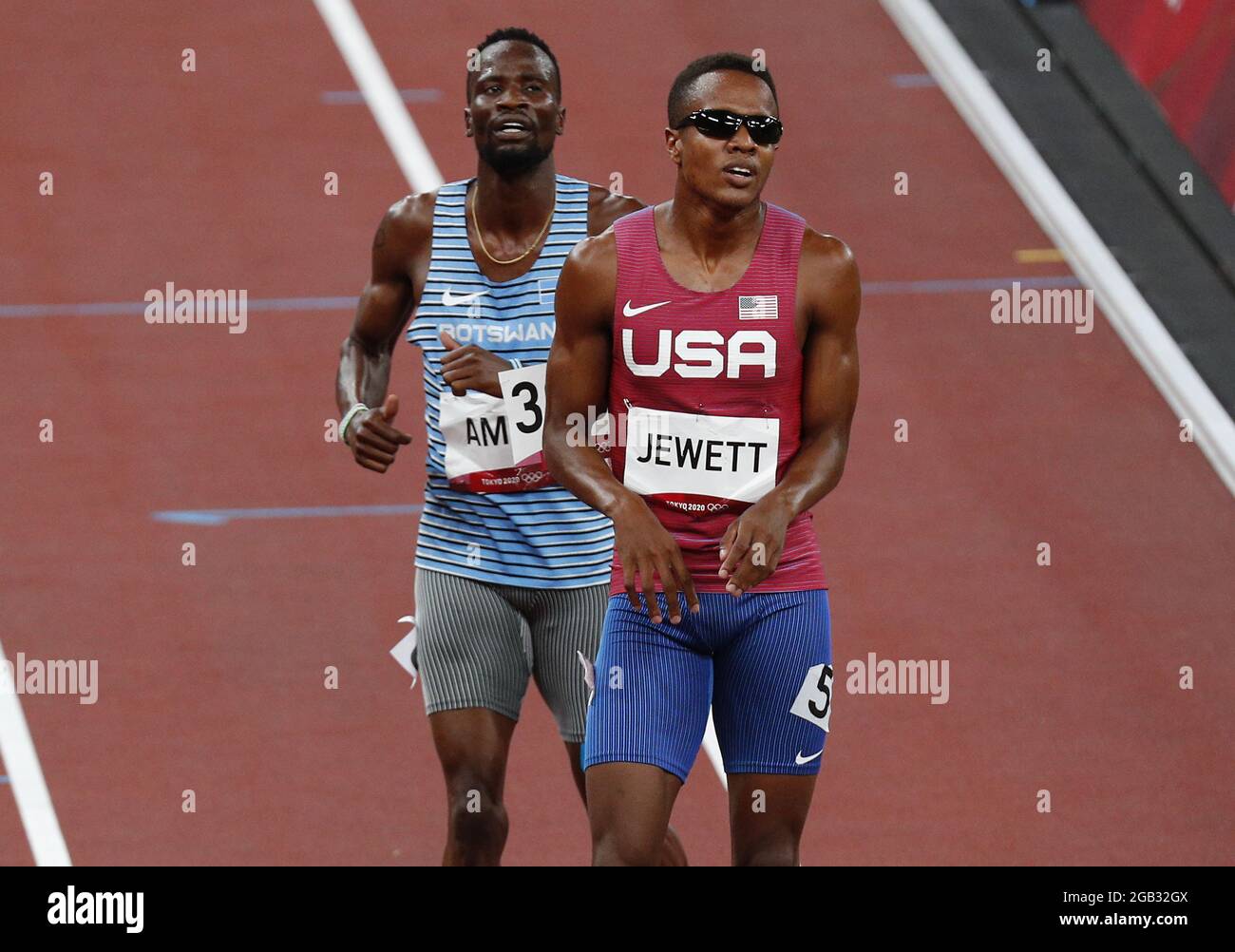 Isaiah Jewett of the USA (R) and Botswana's Nijel Amos cross the finish ...