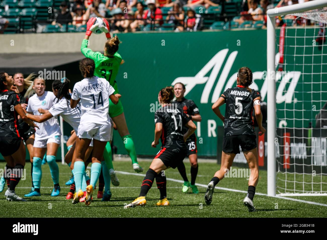 Portland goaltender Bella Bixby jumps for a save, as the Portland ...