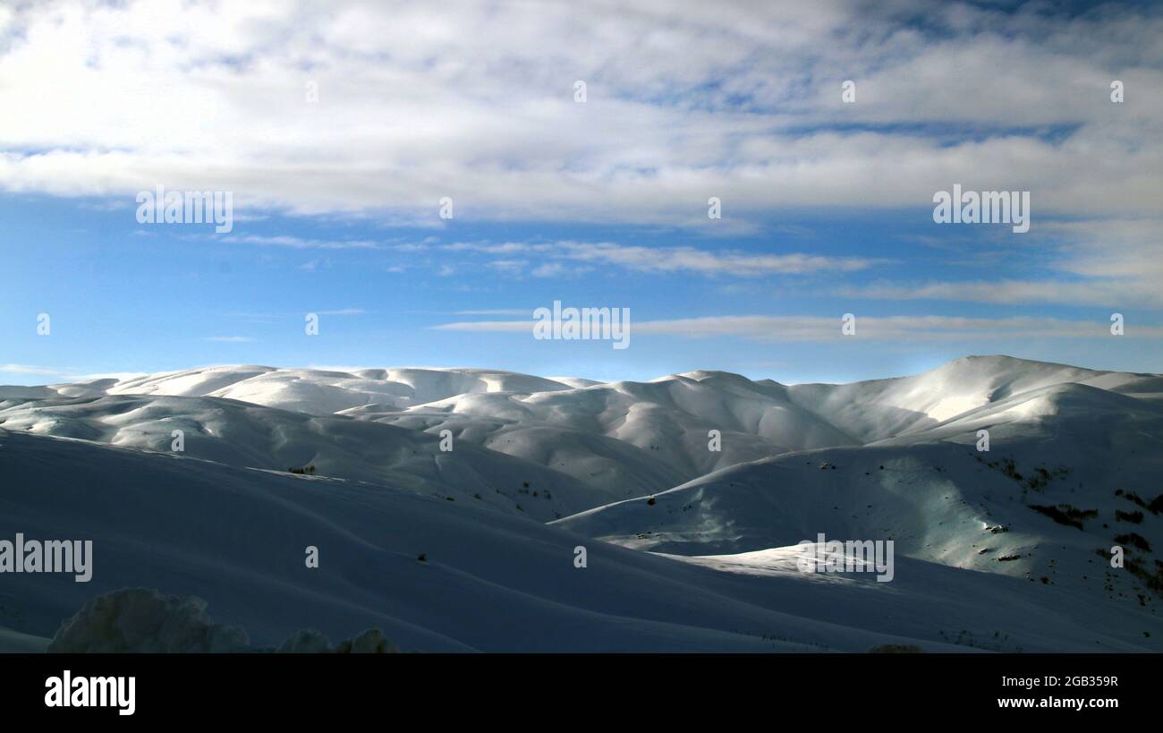 Cloudy mountain landscape in winter Stock Photo - Alamy