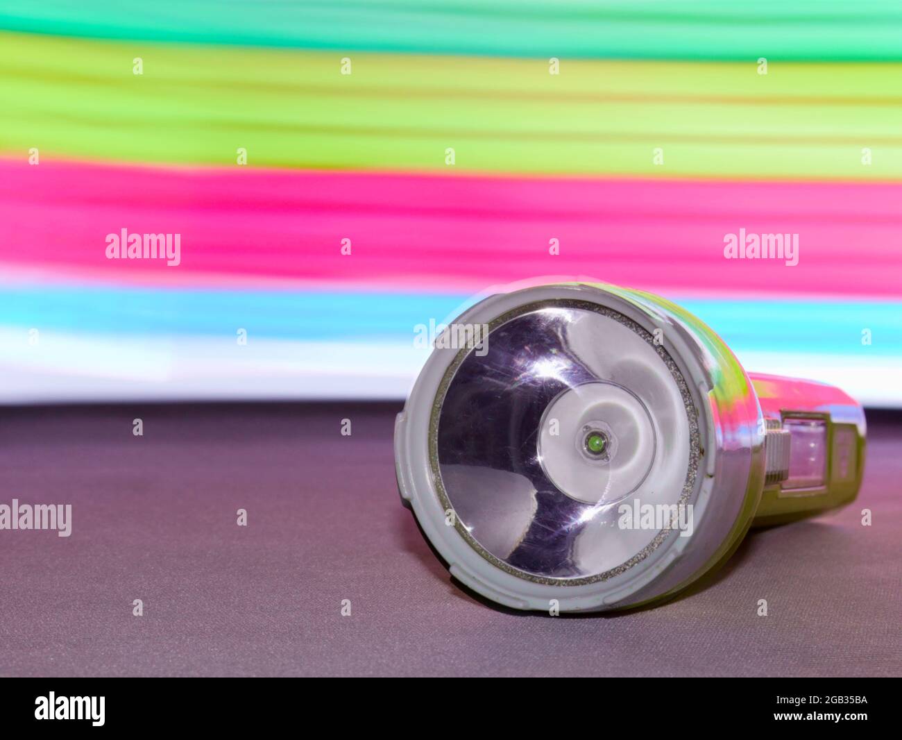 Glass focus electronic chargeable torch presented with rainbow light ...