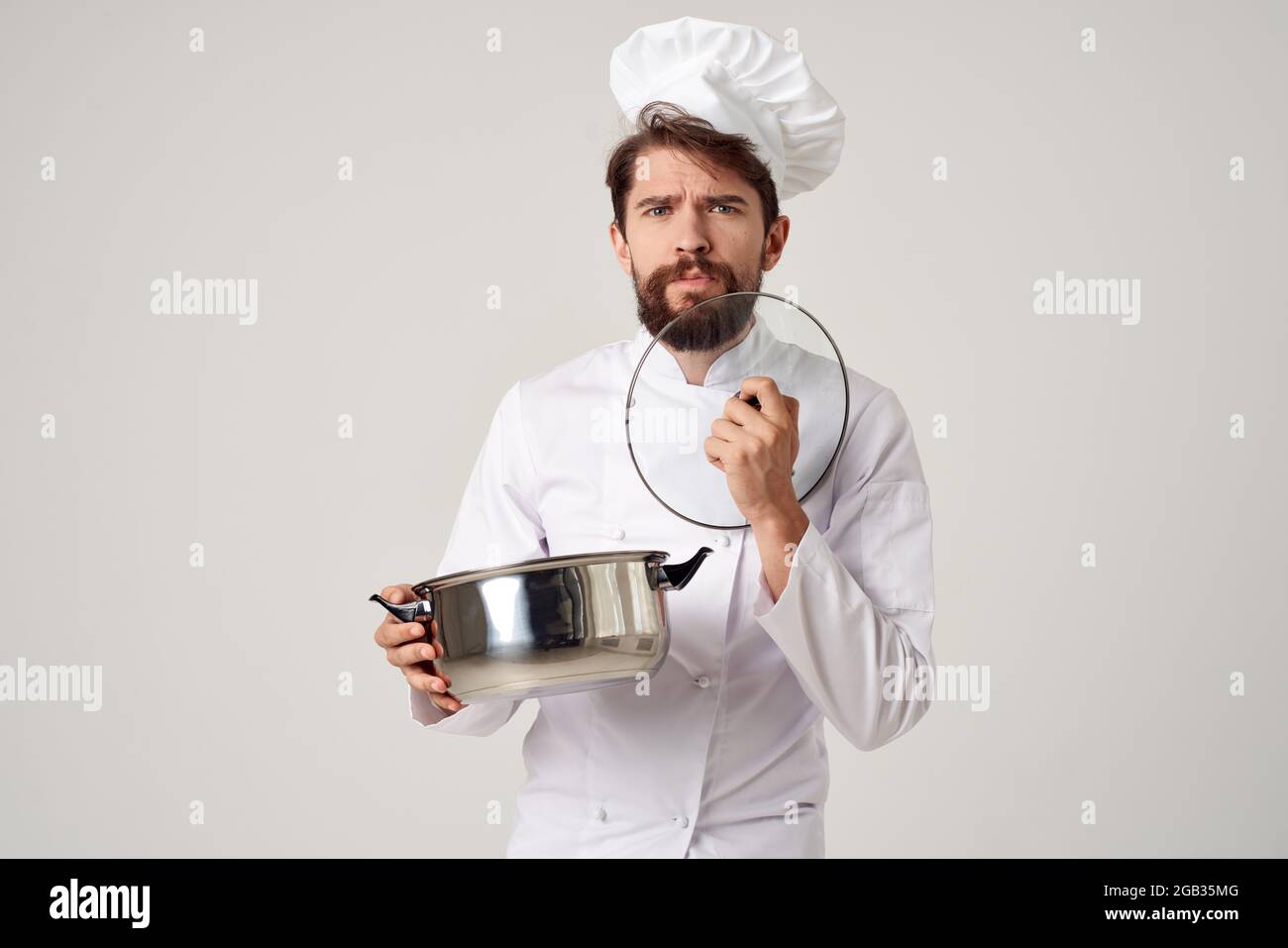 emotional male chef with a saucepan in his hands dissatisfaction ...