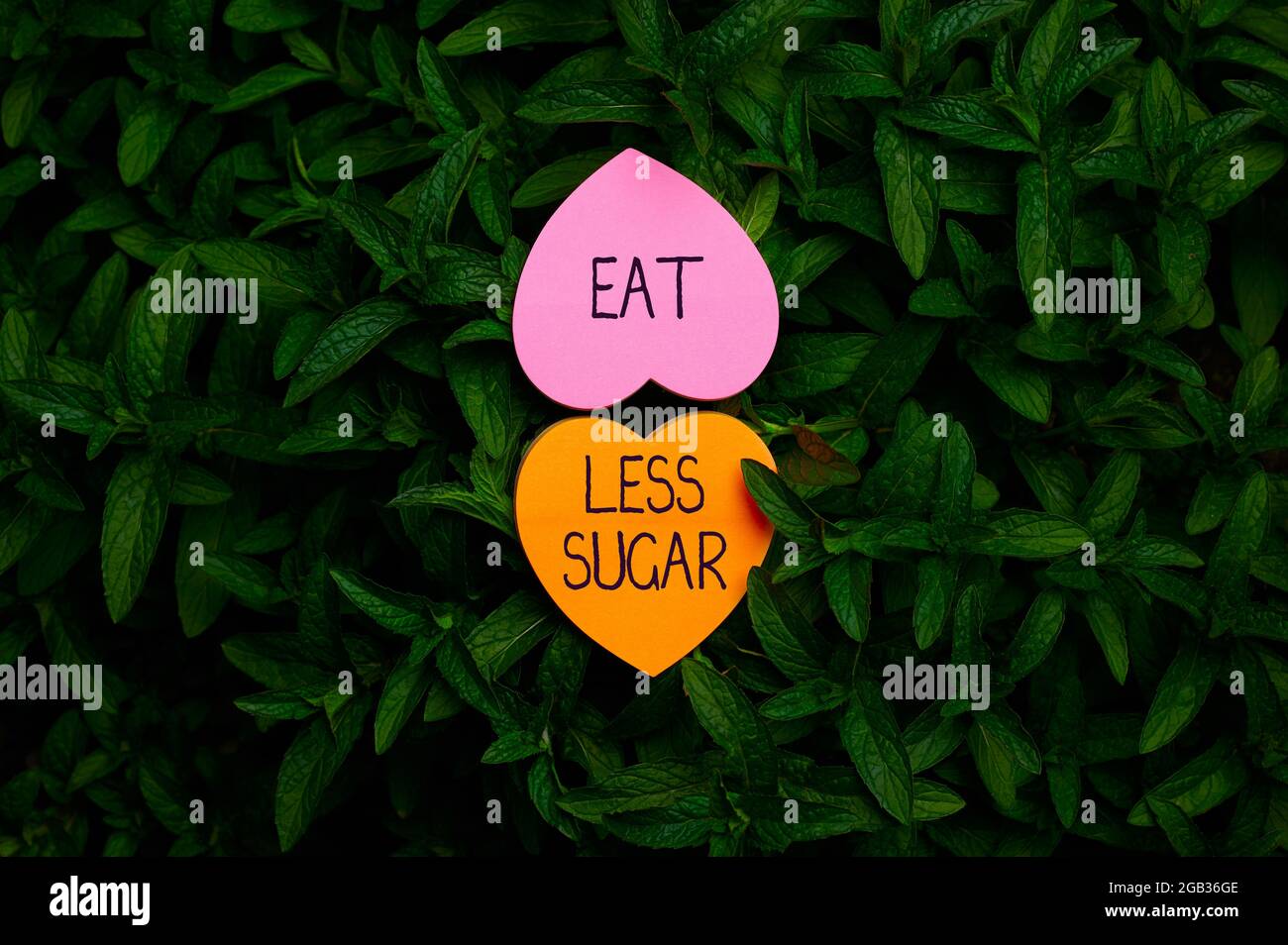 Text caption presenting Eat Less Sugar. Word Written on reducing sugar ...