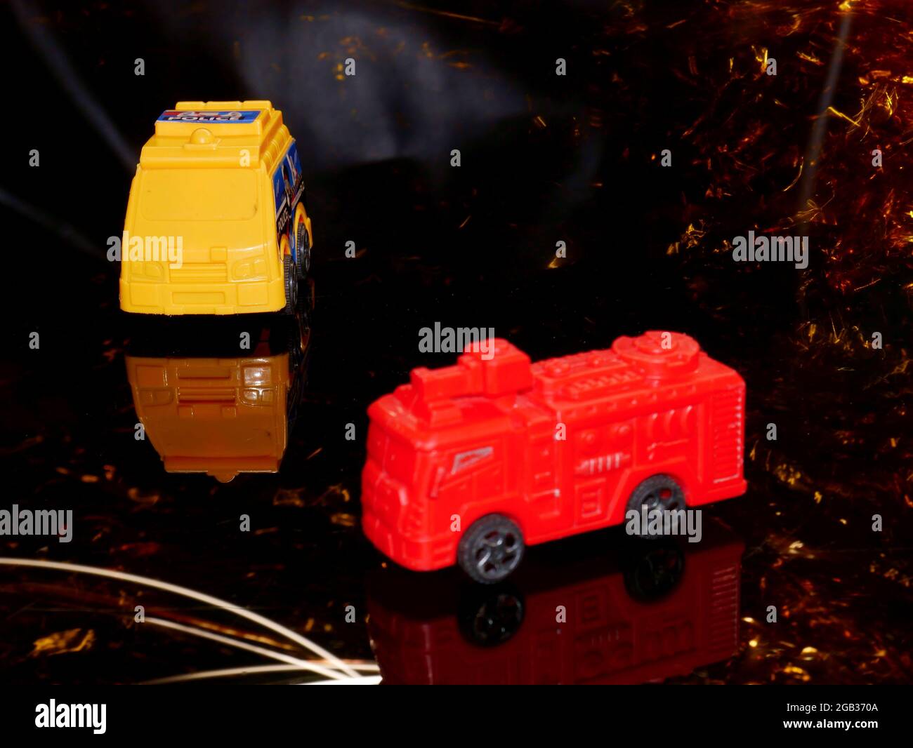 Toy police car and transporting bus accident concept presented with ...