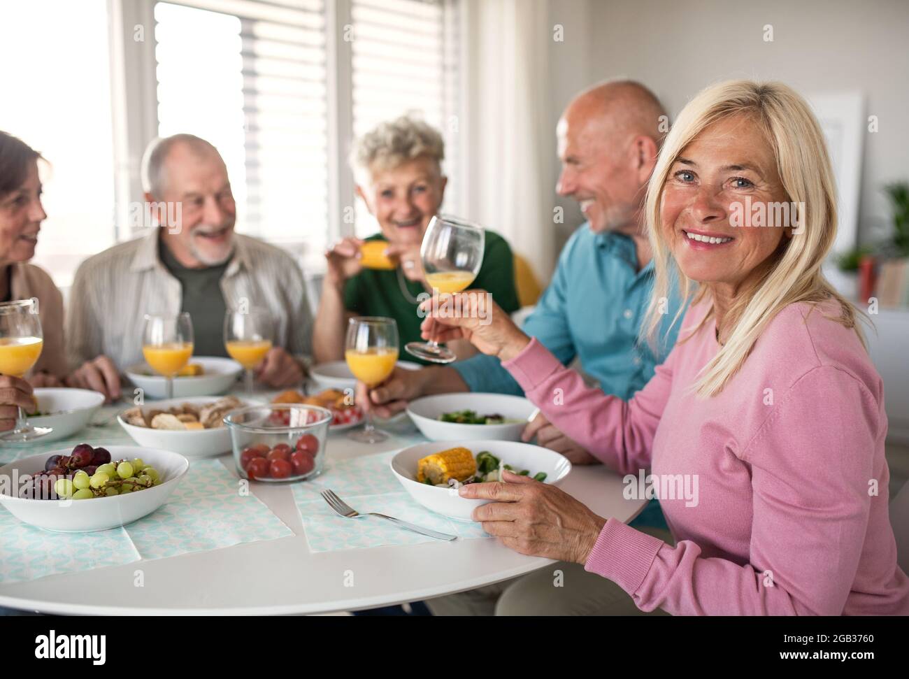 Group of old people table talking High Resolution Stock Photography and ...