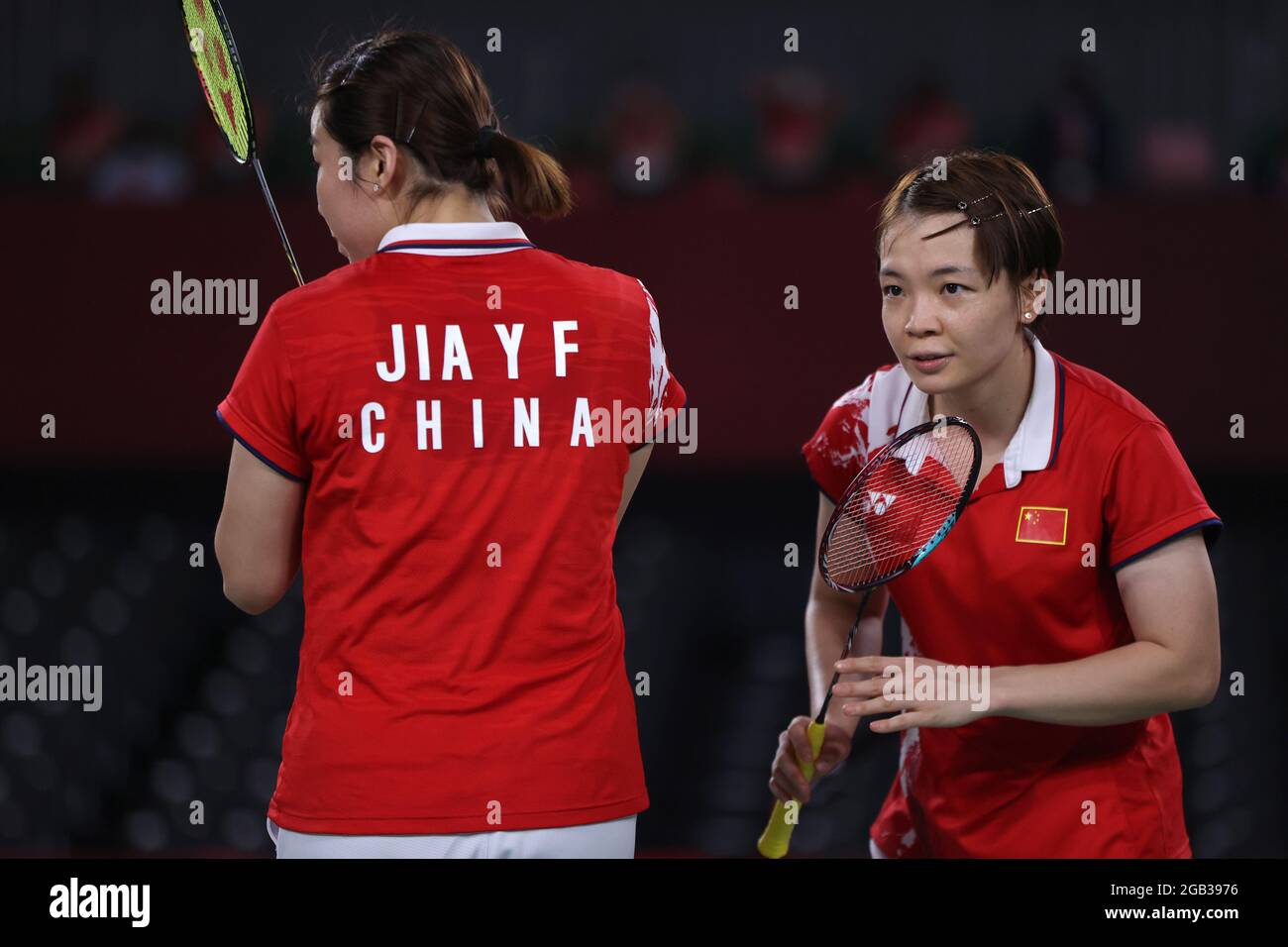 Tokyo, Japan. 2nd Aug, 2021. Chen Qingchen (R)/Jia Yifan of China react during the badminton ...