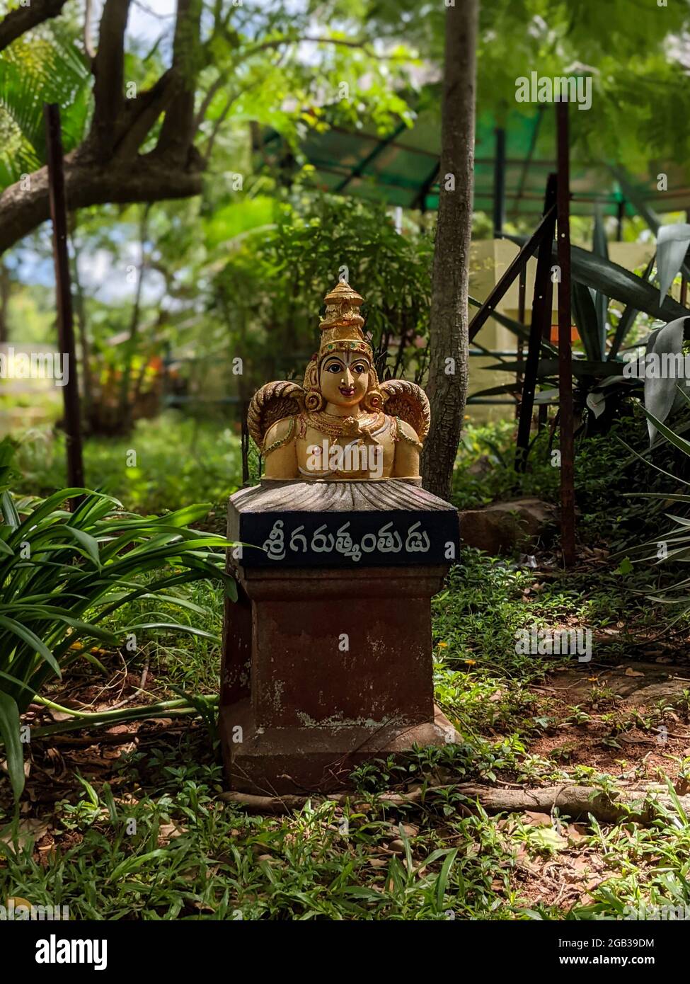 a long vertical shot of Garuda idol in Natural arch rock garden in ...
