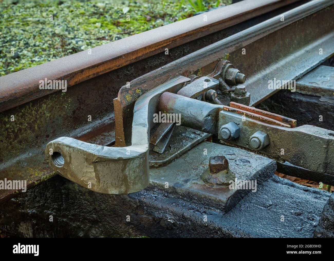 Old railway switch rail areashowing the conection pin Stock Photo - Alamy