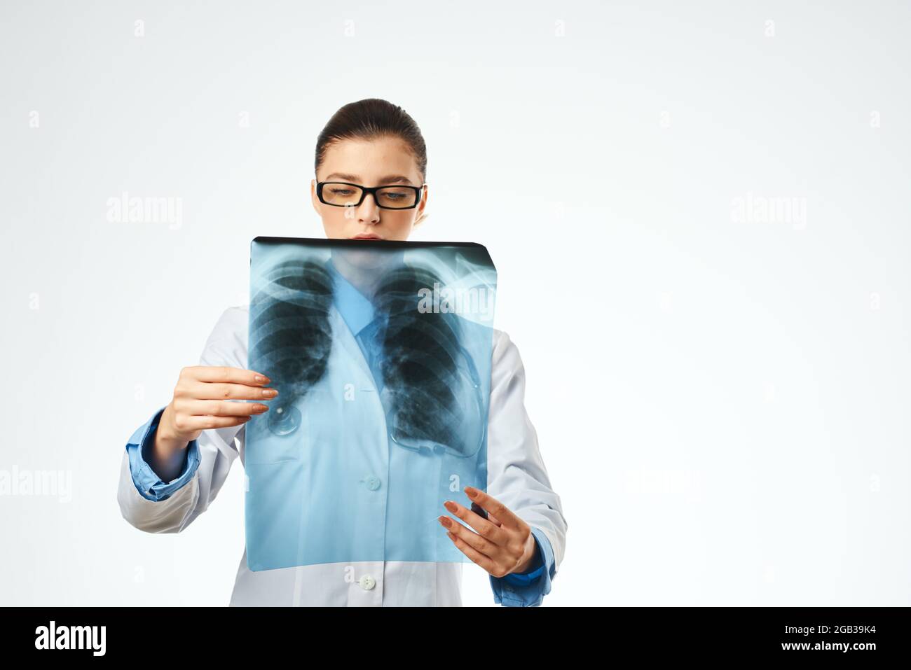 female doctor diagnosis x-ray examination hospital light background ...
