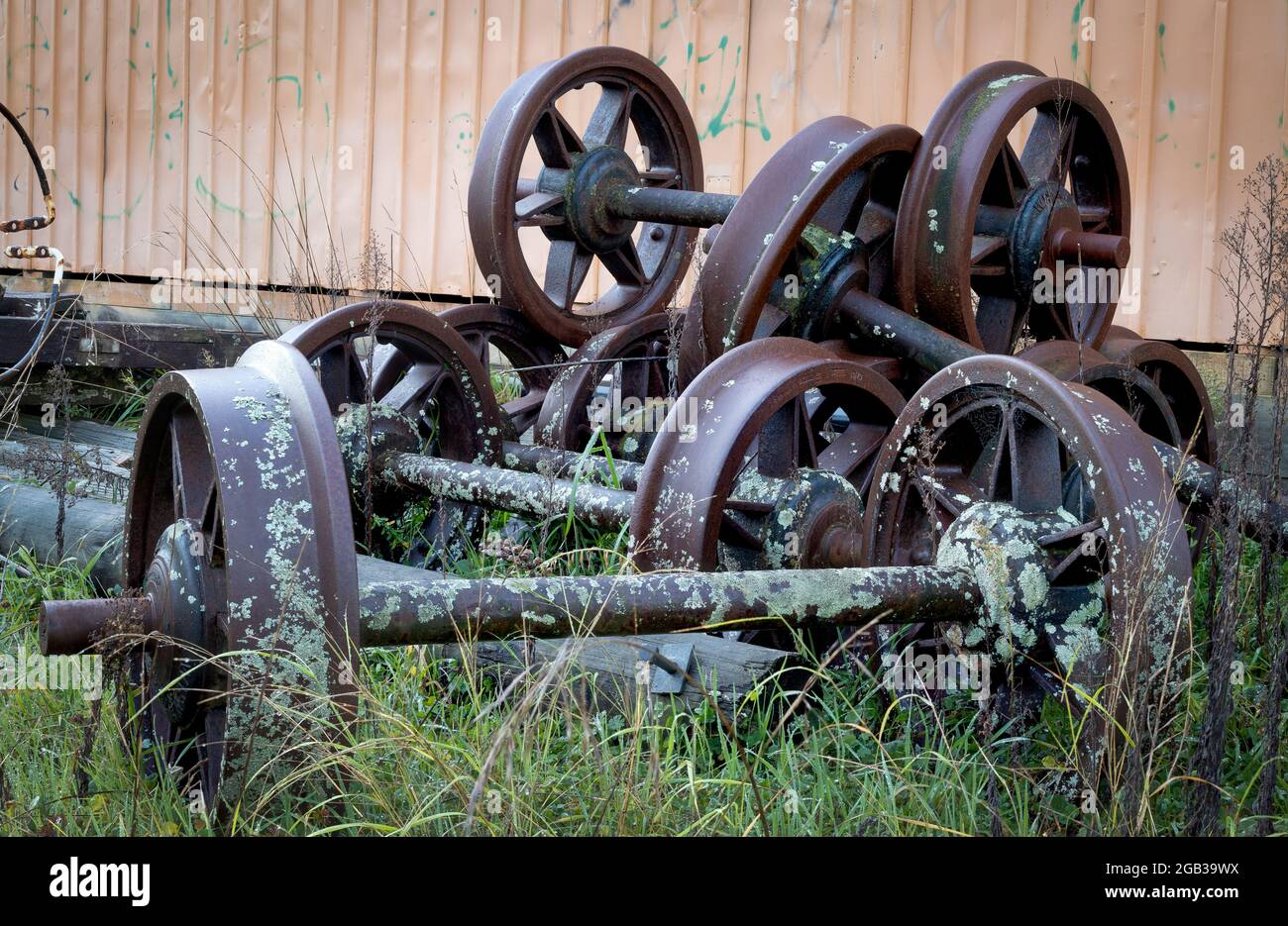 Stack of old unused railway wheels with moss growing on them Stock ...