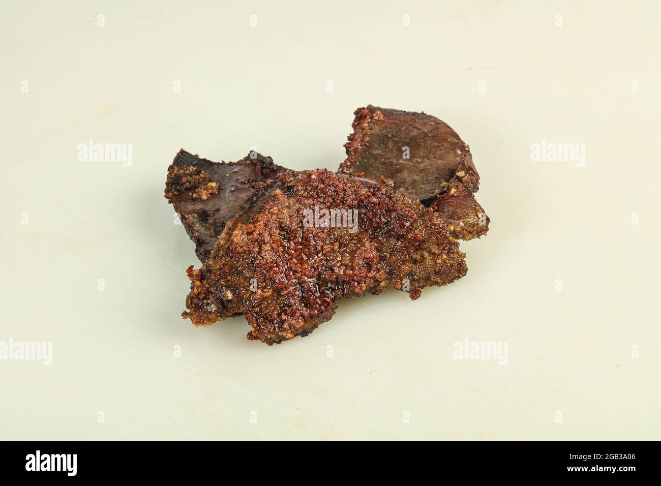 Roasted hot pork liver steak isolated Stock Photo - Alamy
