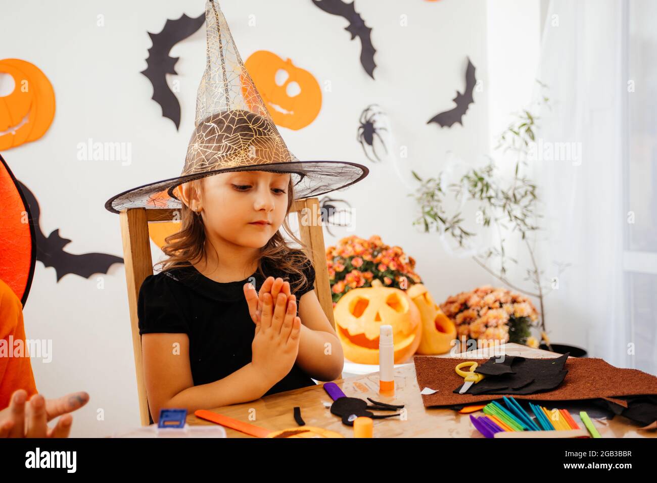Girls doing autumn handicraft during creative workshop Stock Photo - Alamy