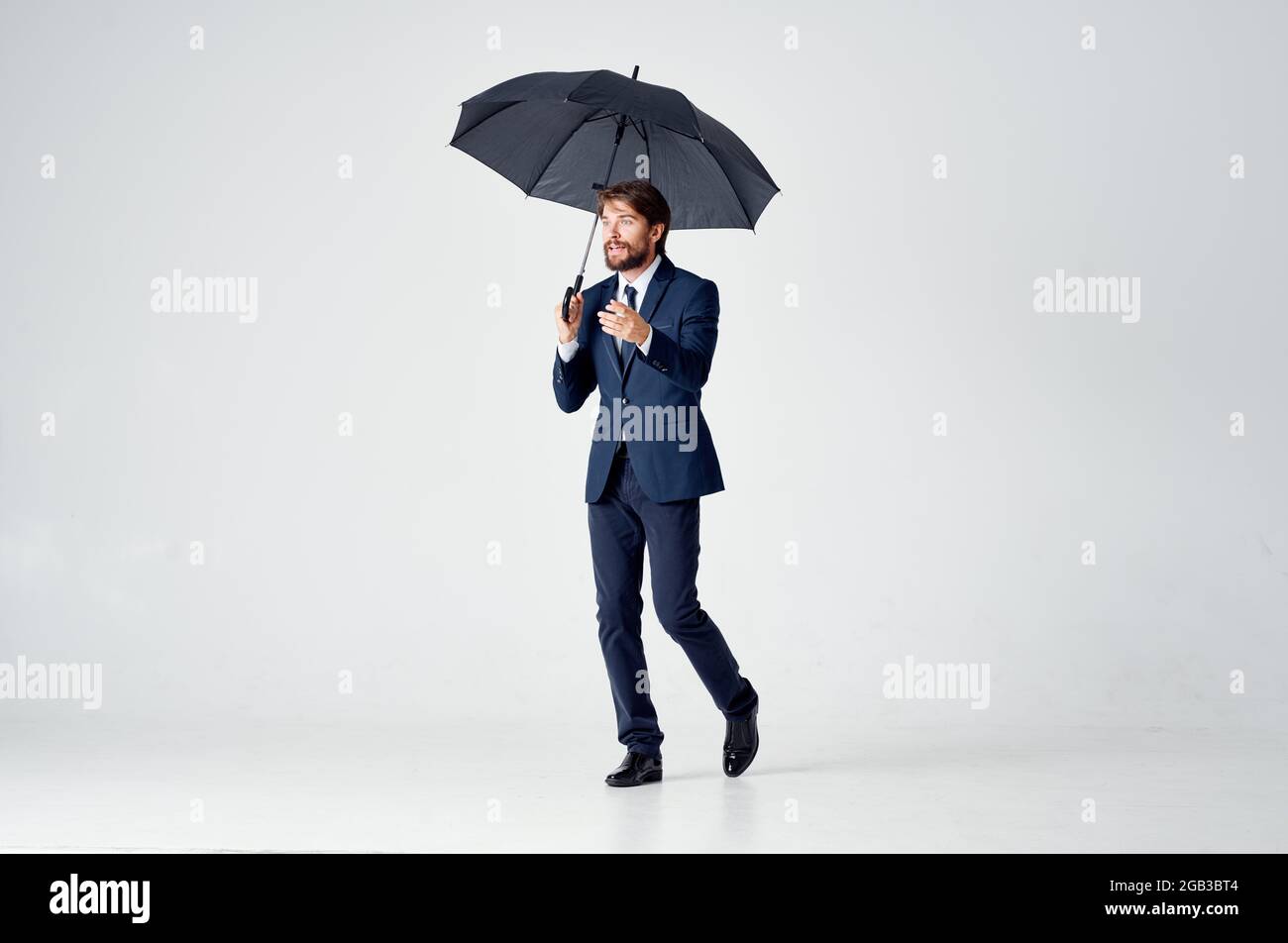 business man in suit umbrella rain protection weather Stock Photo - Alamy