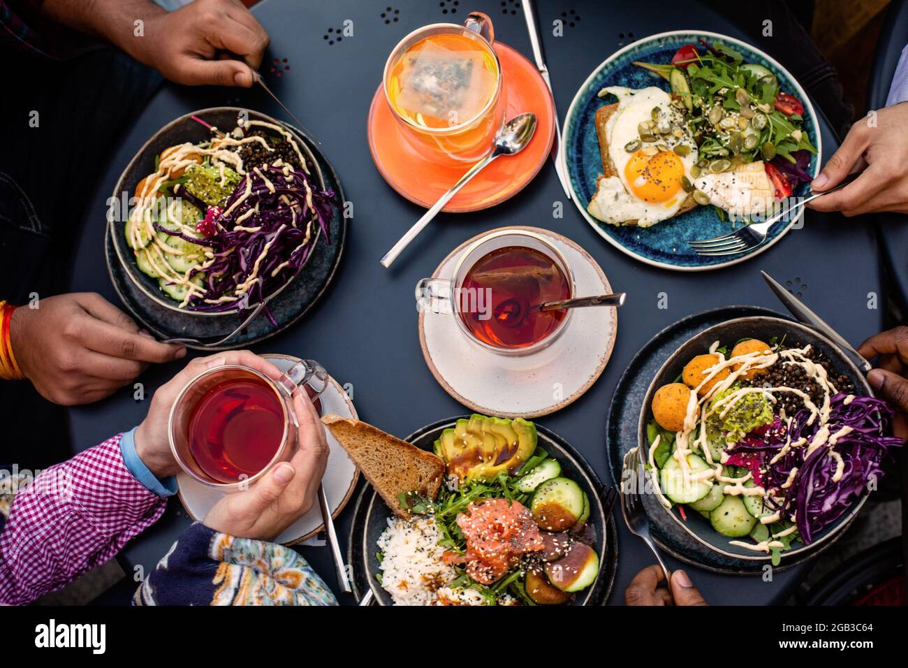 Top view cafe table with bowls of salad Stock Photo - Alamy