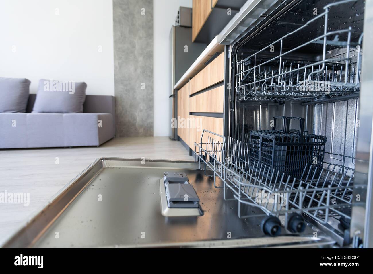 dishwasher with opened door in a kitchen Stock Photo - Alamy