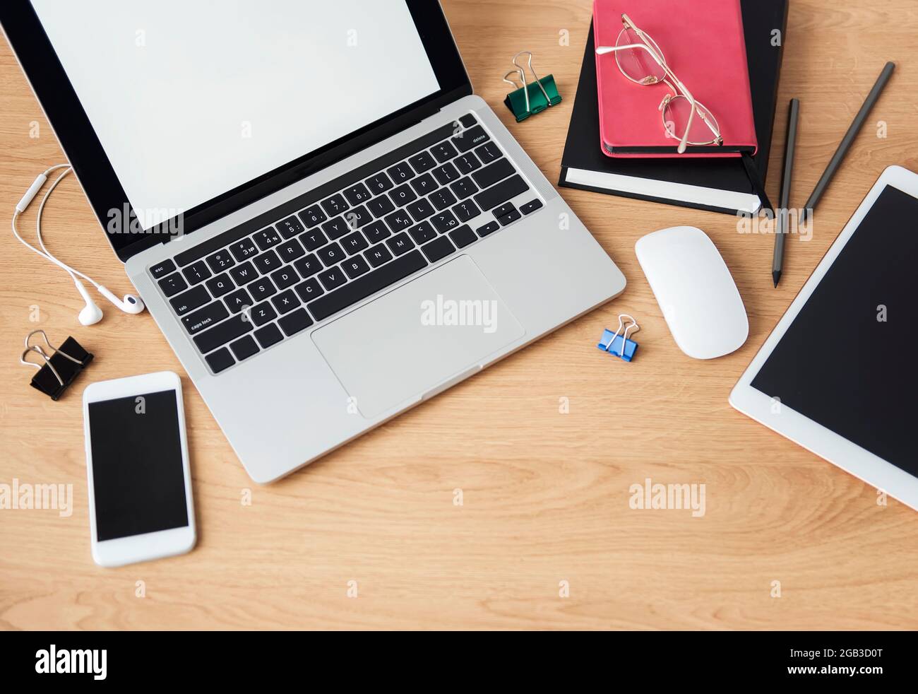 Office workplace with laptop on wooden table Stock Photo - Alamy