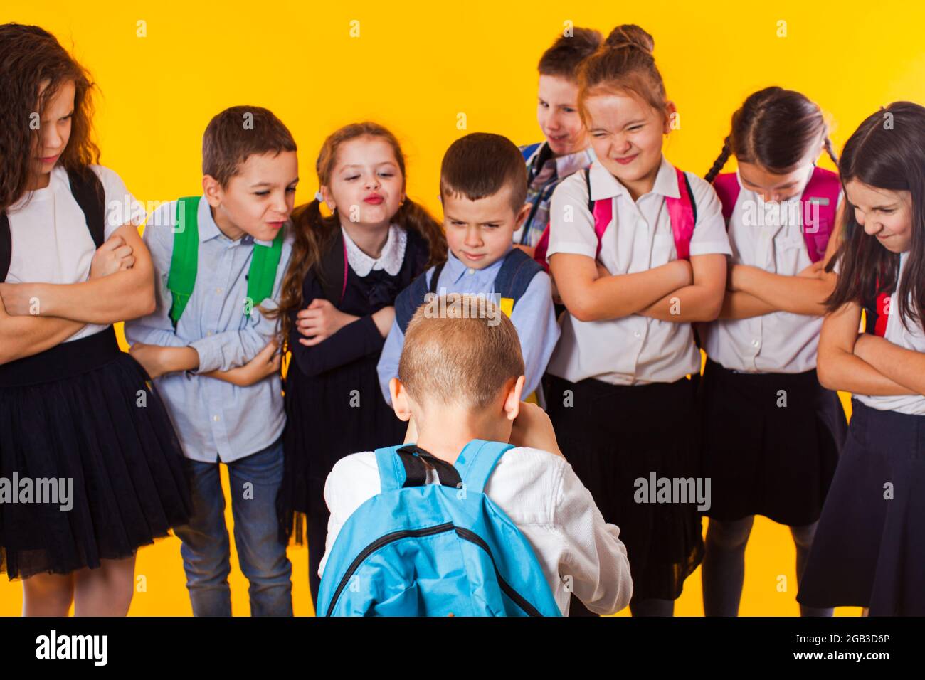 The classmates point to the boy and laugh at him Stock Photo - Alamy