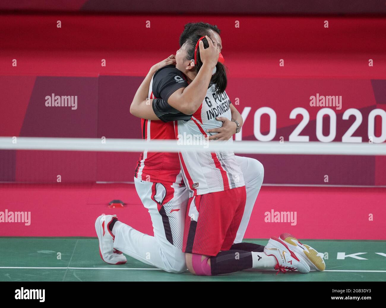 Tokyo, Japan. 2nd Aug, 2021. Greysia Polii (R) of Indonesia hugs her ...