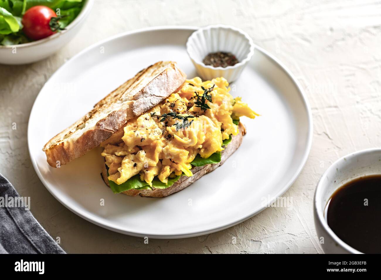 Scramble Egg Sandwich with Salad and a cup of coffee Stock Photo - Alamy