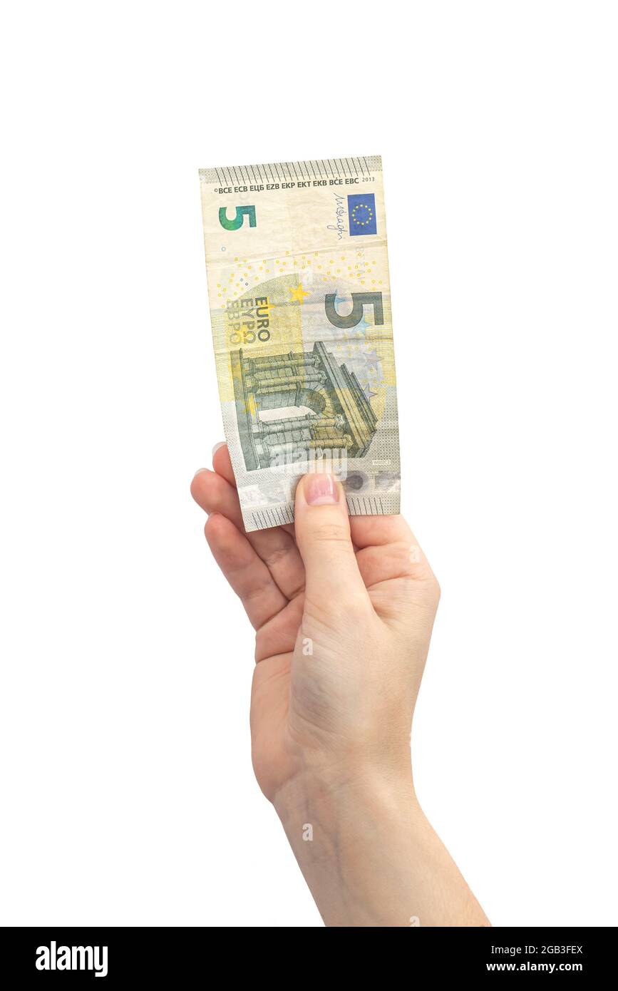 Five euro in hand isolated on white background, woman hand with ...